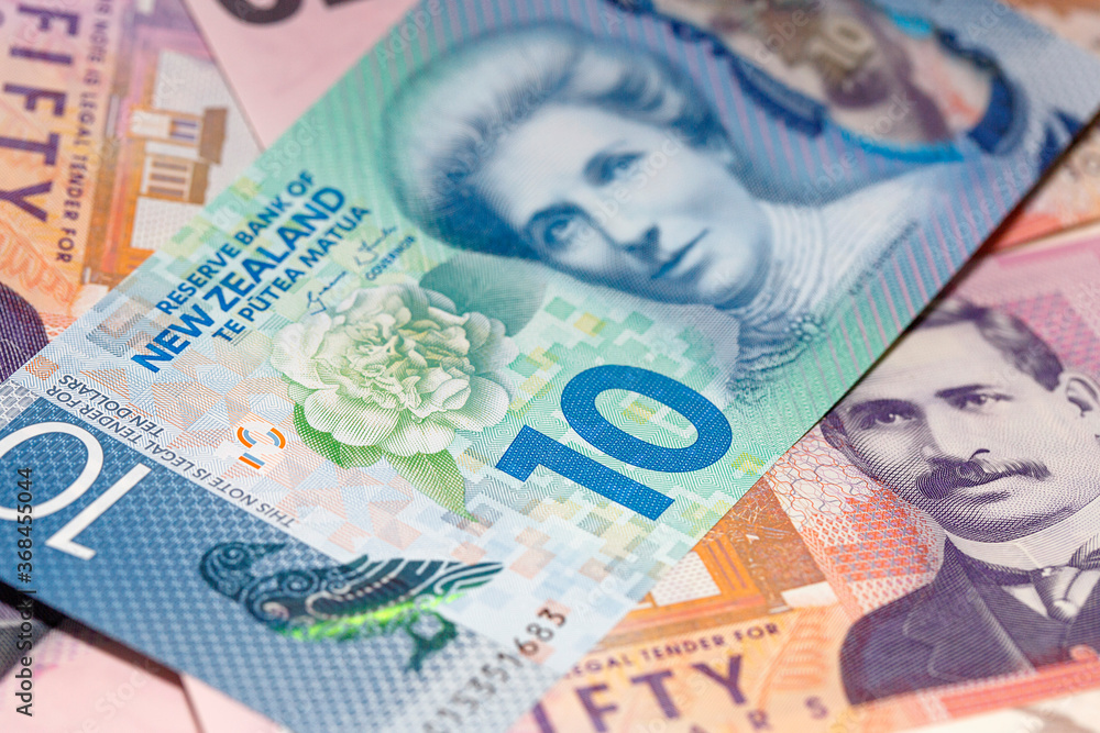 New Zealand Currency - New Zealand ten dollar banknote laid over a ...