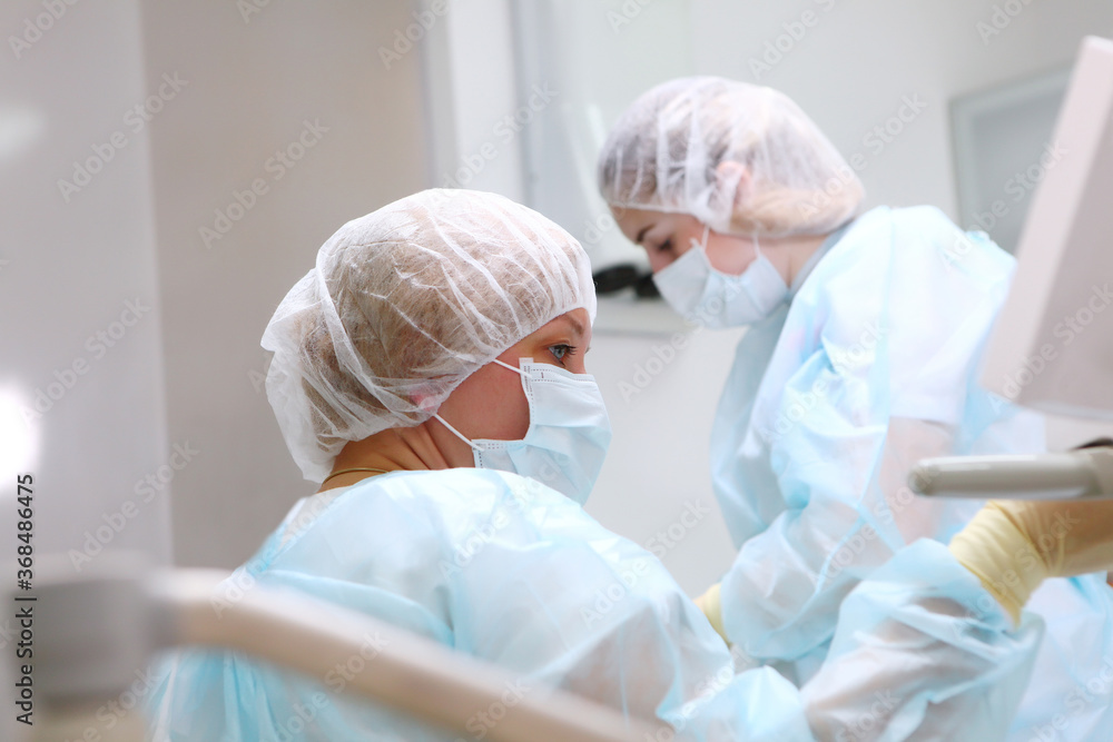 Operations under General anesthesia. Portrait of a dentist. Removal of ...