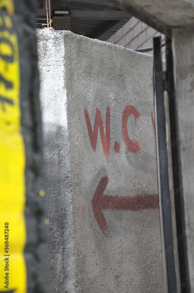 WC Toilet sign against the background of mexico city, Handpainted WC ...