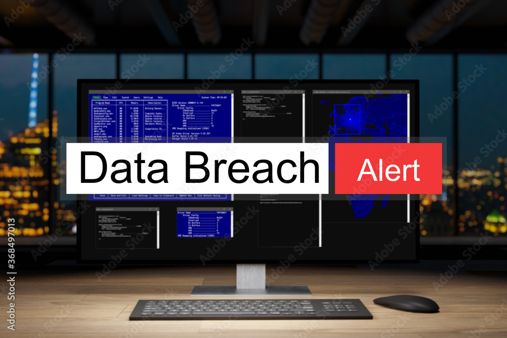 computer workstation in dark night office with skyline view warning ...