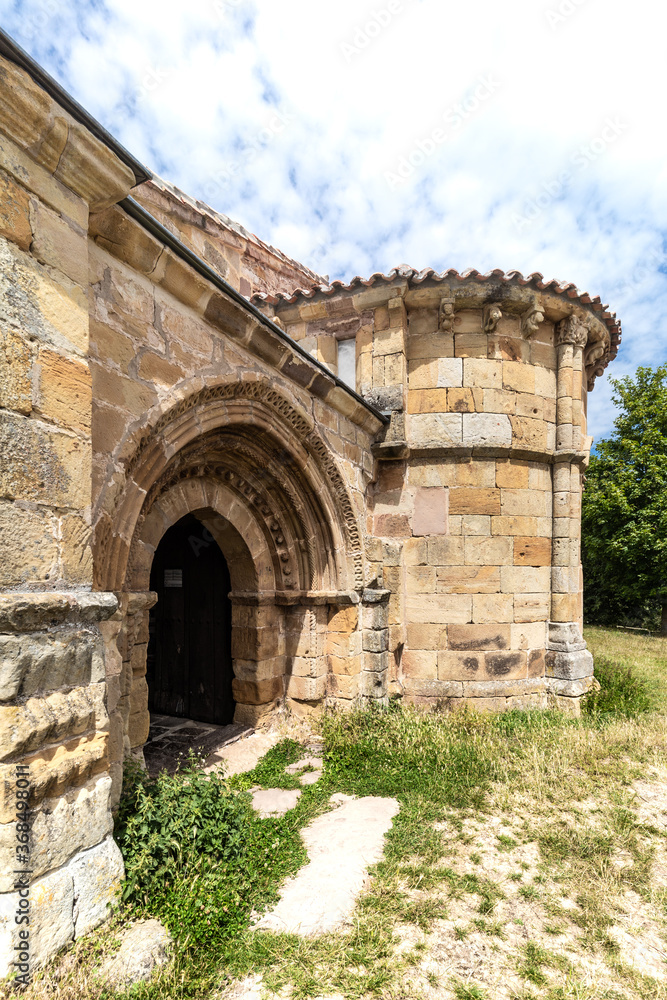 Romanesque apse and main door of church in Villacantid, Cantabri Stock ...