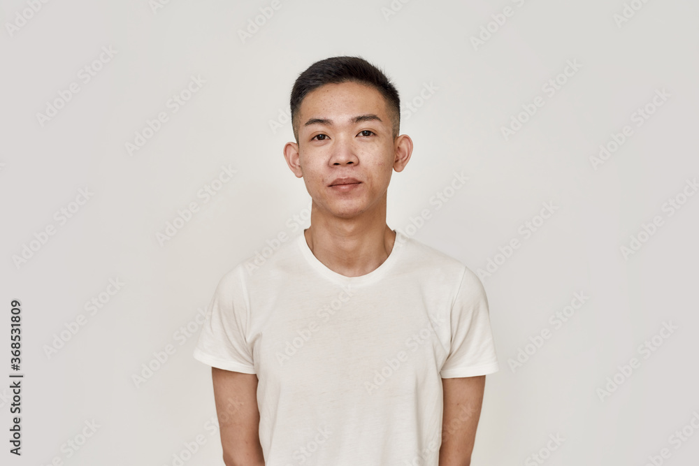 Clean skin. Portrait of young asian man with clean shaven face looking ...