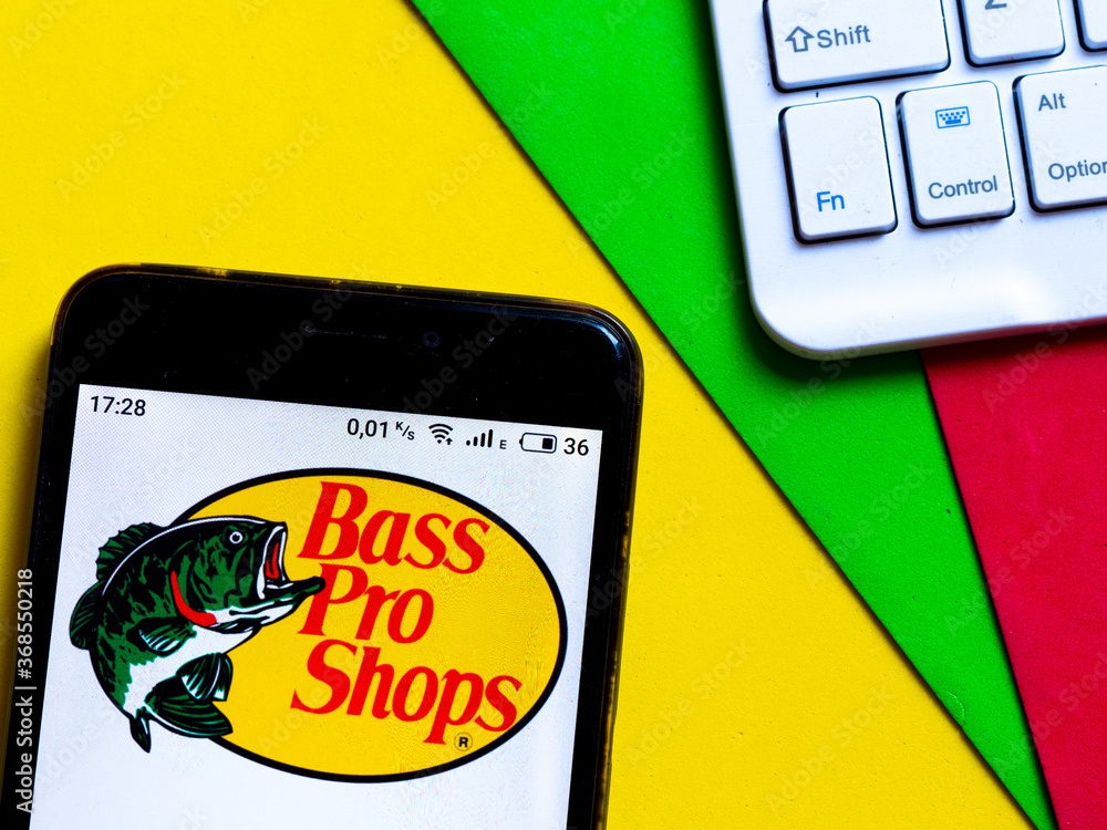 In this photo illustration e-commerce a Bass Pro Shop logo is seen ...