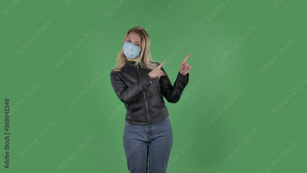 Portrait of beautiful young woman in medical protective face mask ...