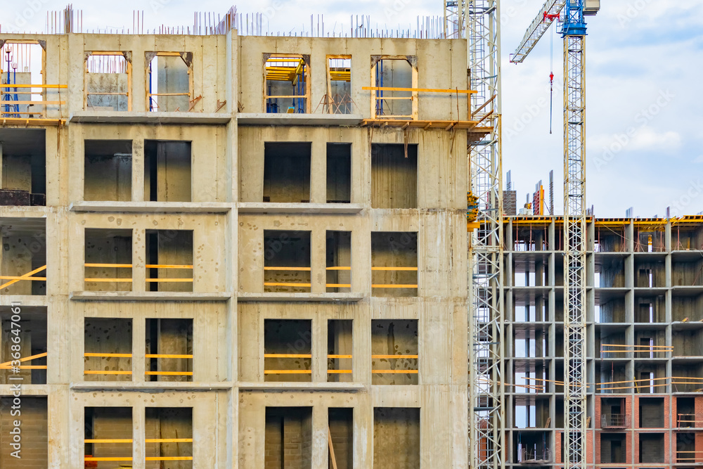 Two multi-story buildings are being built nearby. Construction of a new ...