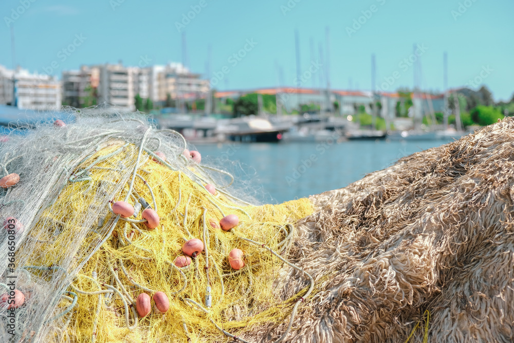 Colourful fishing nests piled up in the harbor on a greek island Stock ...