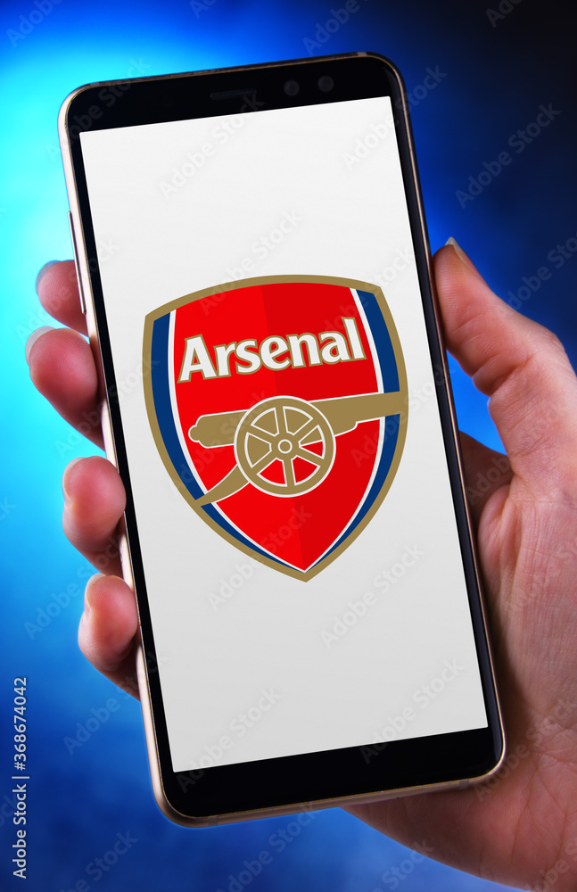 Hand holding smartphone displaying logo of Arsenal FC Stock Photo ...