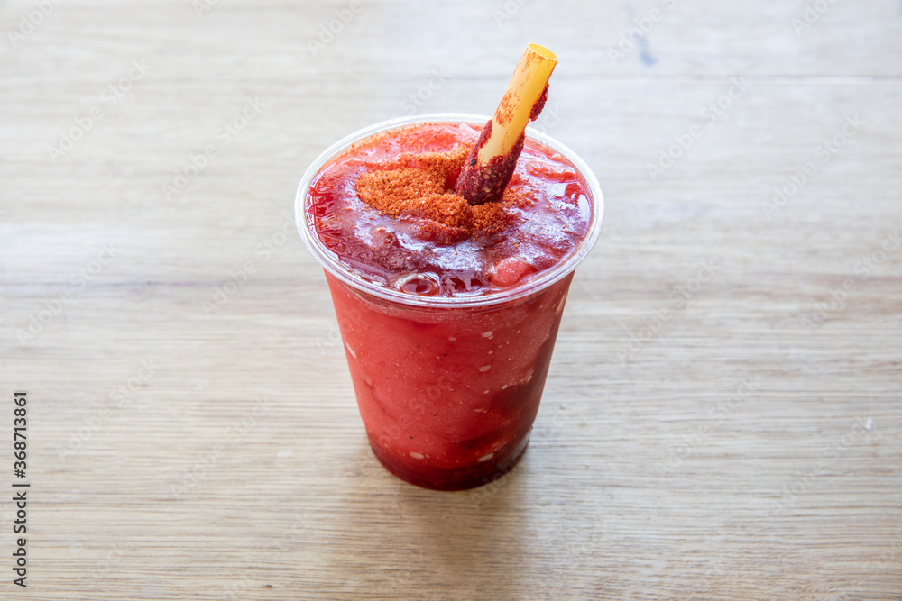 Chamoyada is a mexican fresh beverage made with chamoy, ice and fruit ...