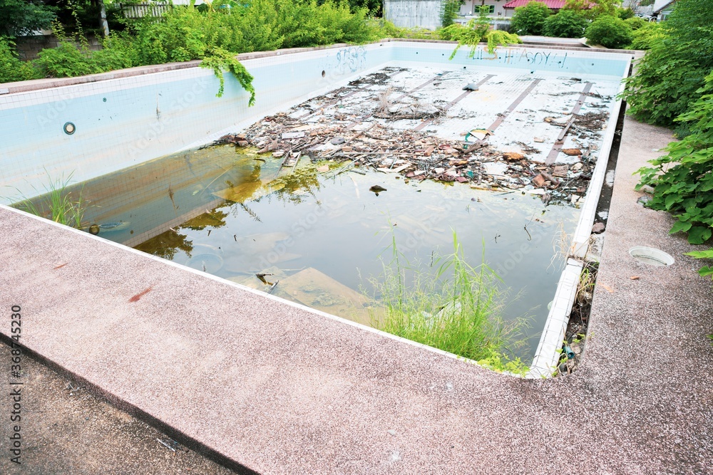 Abandoned public swimming pool in Thailand, garbage in dirty water ...