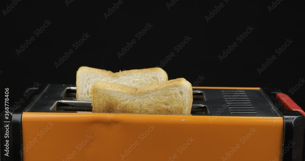 Toaster switches off and the toasted bread rises. Stock ビデオ | Adobe Stock