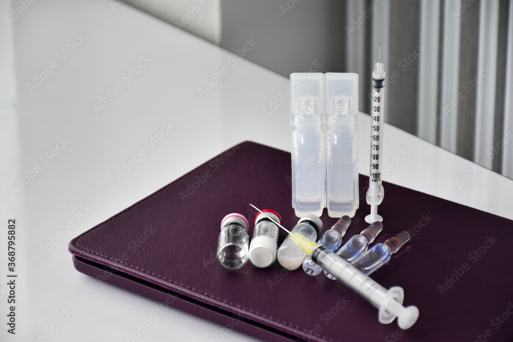 Medical equipments, injections, insulin, serum and vaccine bottles, on ...