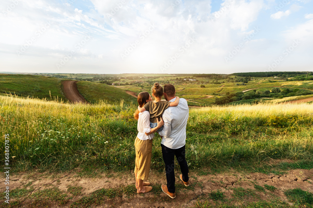 Happy family enjoying beautiful landscape outdoors in the field Stock ...