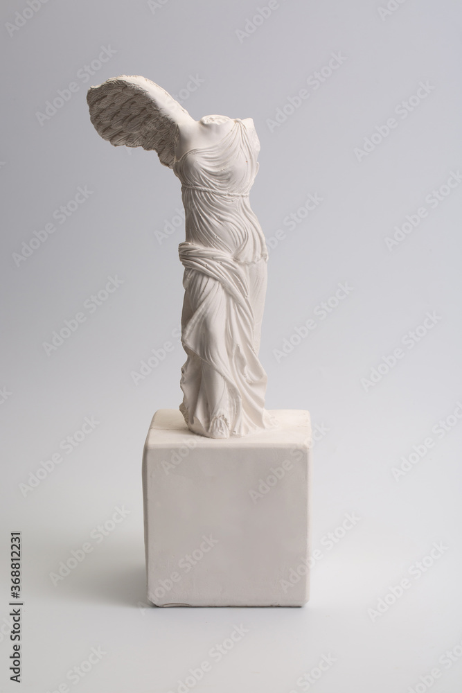 Greek goddess of victory sculpture on white background Stock Photo ...
