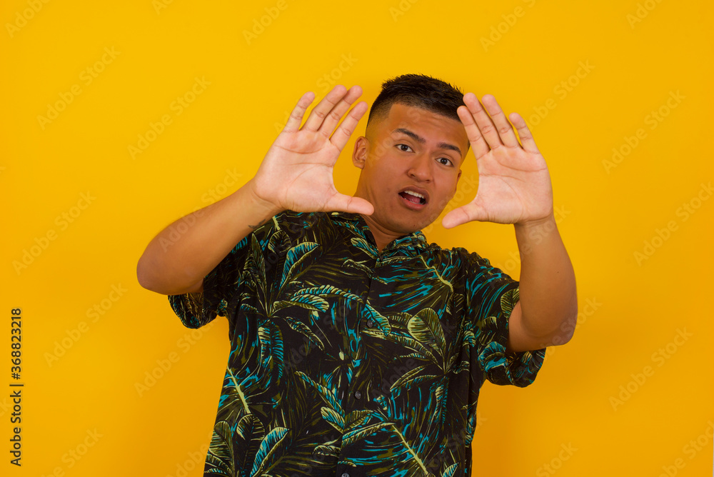 Dissatisfied male model frowns face, has disgusting expression, shows ...