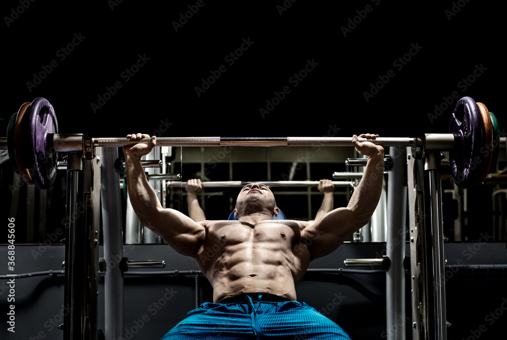 Man bodybuilder perform exercise Stock Photo | Adobe Stock