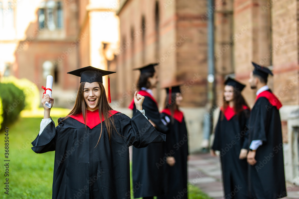 Education, graduation and people concept. Group of happy international ...