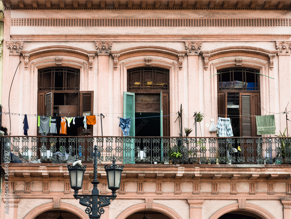 Facade of an old residential building in Havana, Cuba. Close-up of a ...