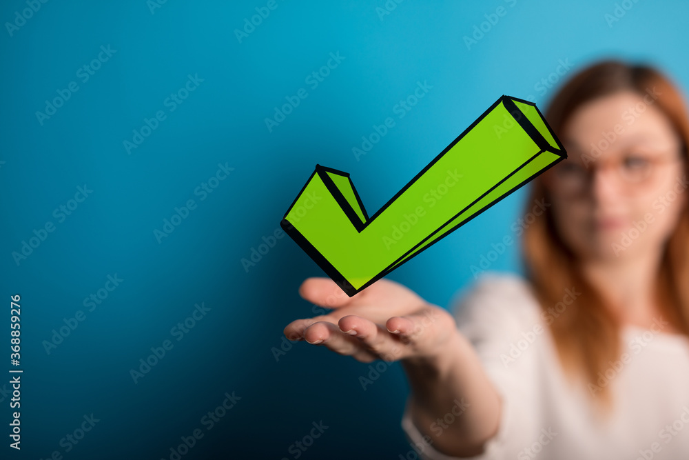 check mark in hand Stock Photo | Adobe Stock