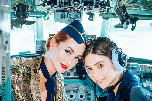 Plakat Portrait of two smiling women pilots. Beautiful Smiling Young ...
