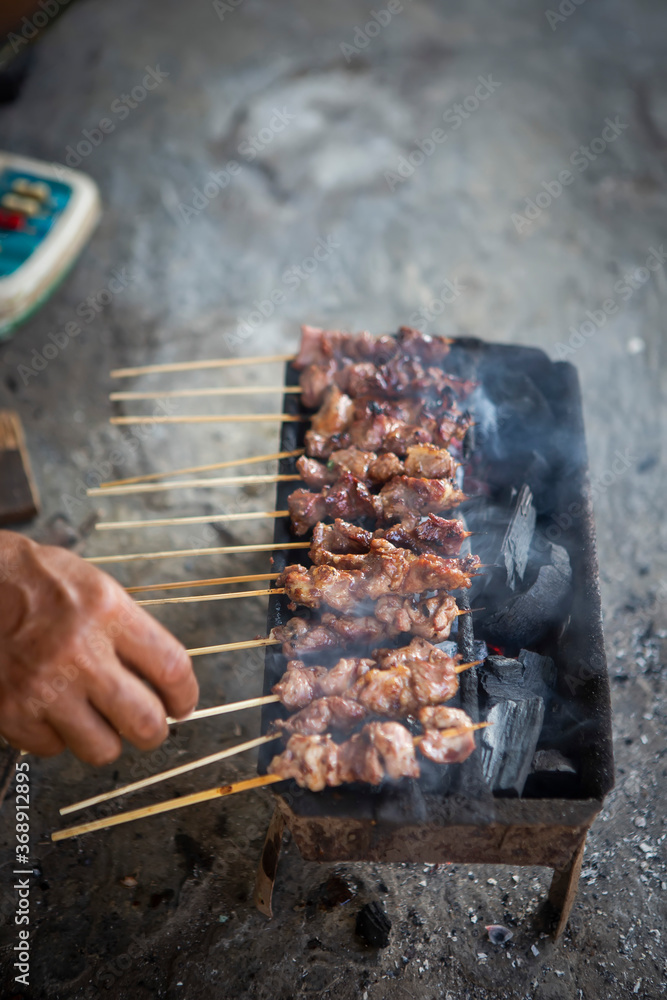 Satay goat satay, lamb, lamb or meat goat satay in grilling place with ...