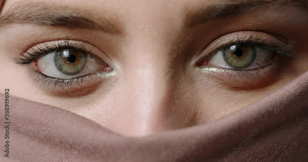Face of muslim girl wearing traditional hijab head scarf and makep. Her ...