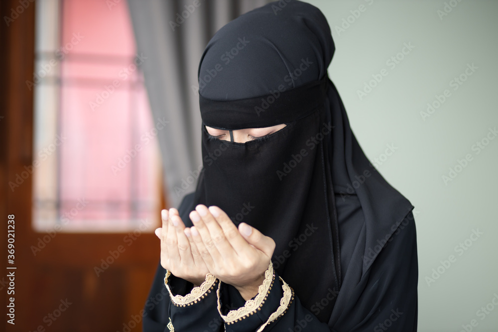 young modern middle eastern muslim woman with islamic prayer hand ...