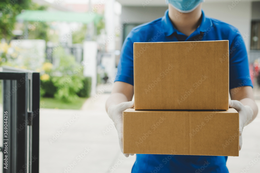 delivery service man in blue uniform waiting for sending parcel post ...