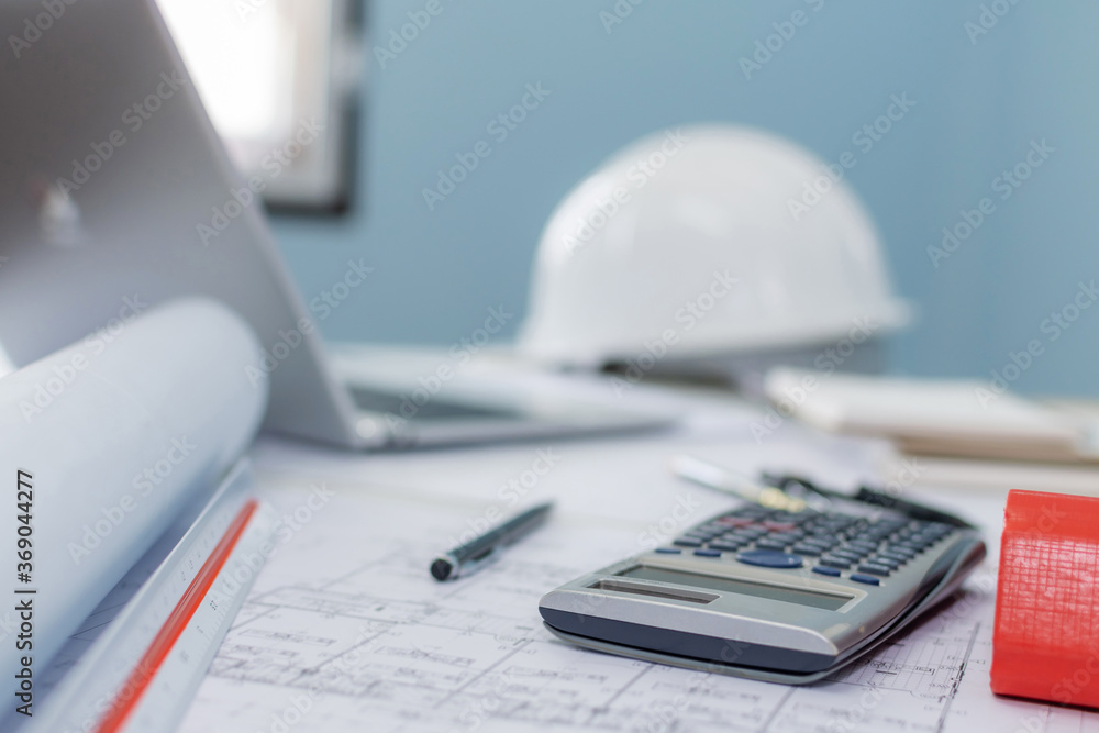construction working tool, calculator, blueprint and safety helmet on ...