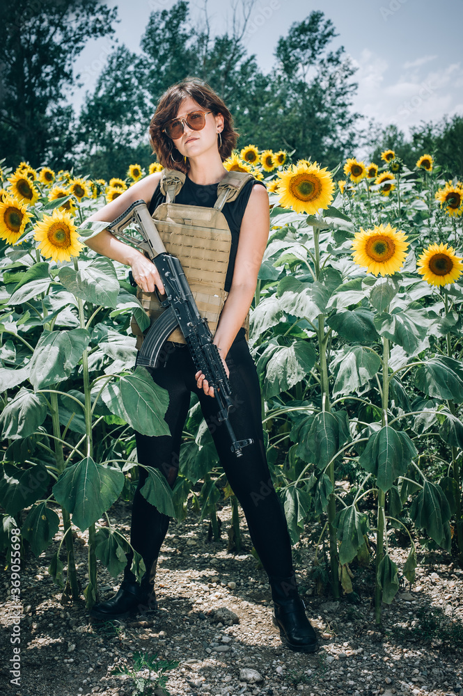 Beautiful and attractive woman soldier with rifle machine gun. Front ...