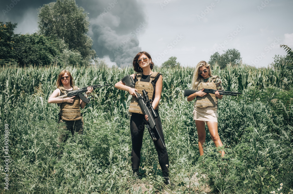 Combat team squad of attractive female military soldier on war zone ...