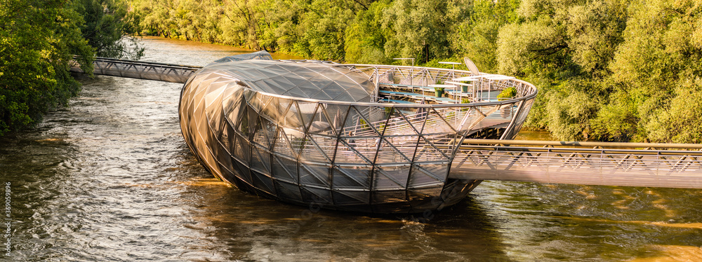 Mur river in Graz famous landmark and called Murinsel, island bridge ...