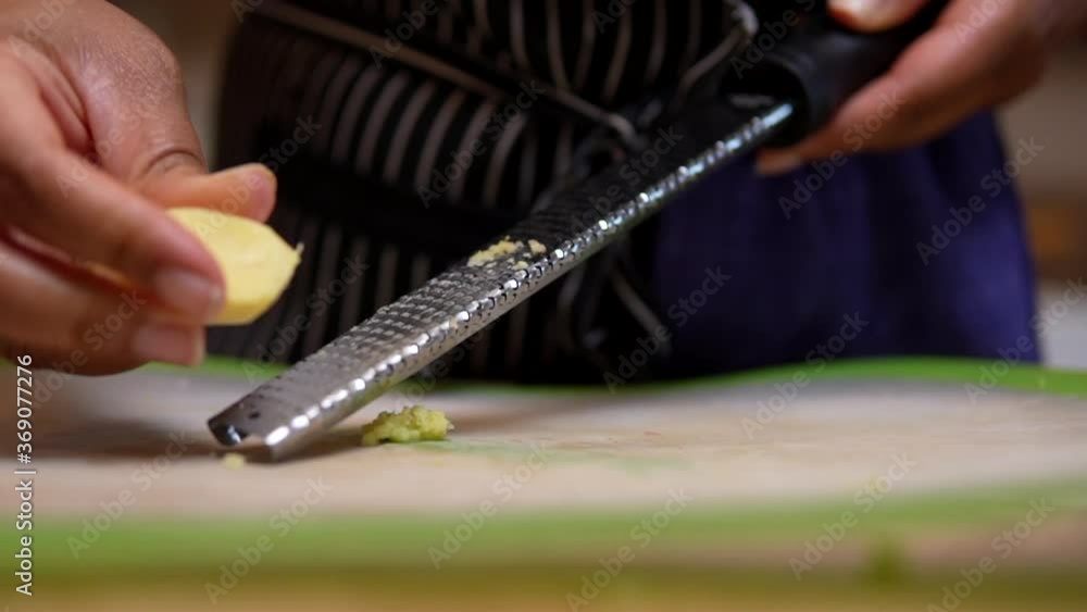 Grating or mincing ginger root for a homemade recipe - slow motion ...
