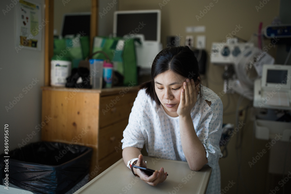 Pregnant Asian Woman In Early Stages Of Labor Stock Photo | Adobe Stock