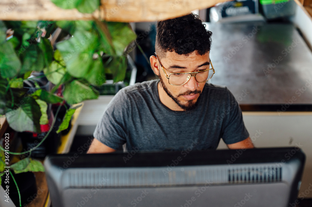 Cashier using cash register in a restaurant Stock Photo | Adobe Stock