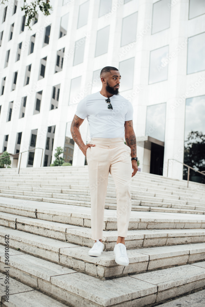 Man walking down steps Stock Photo | Adobe Stock