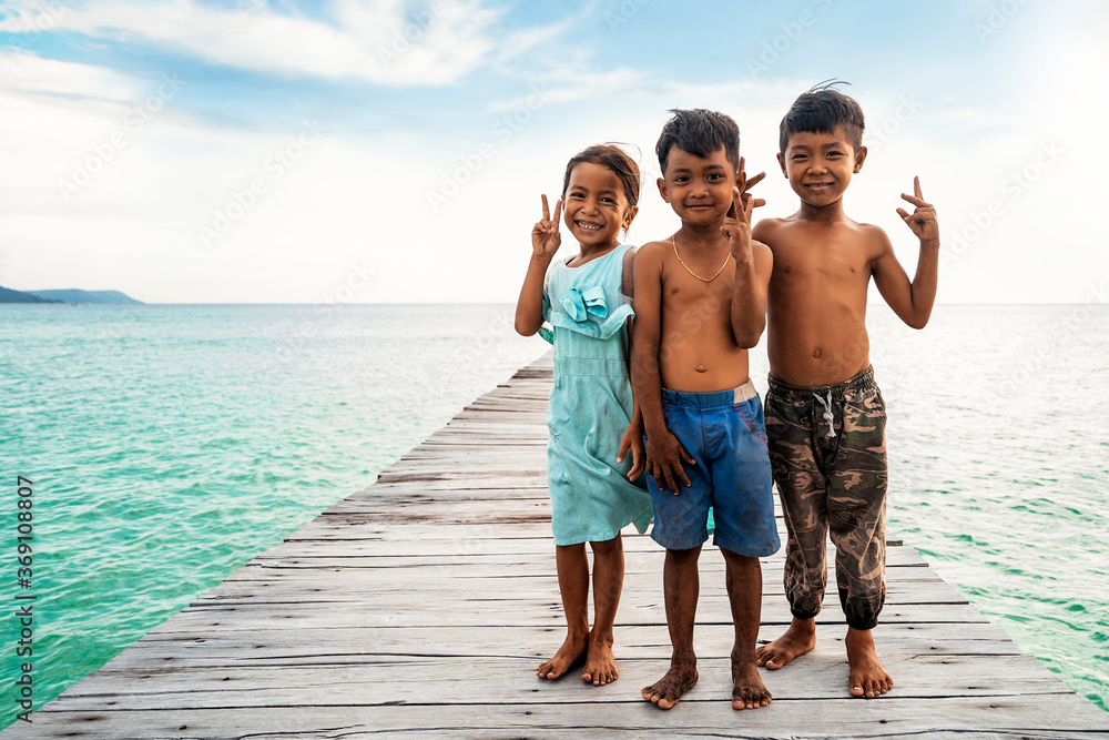 Portrait of three children looking at camera Stock Photo | Adobe Stock