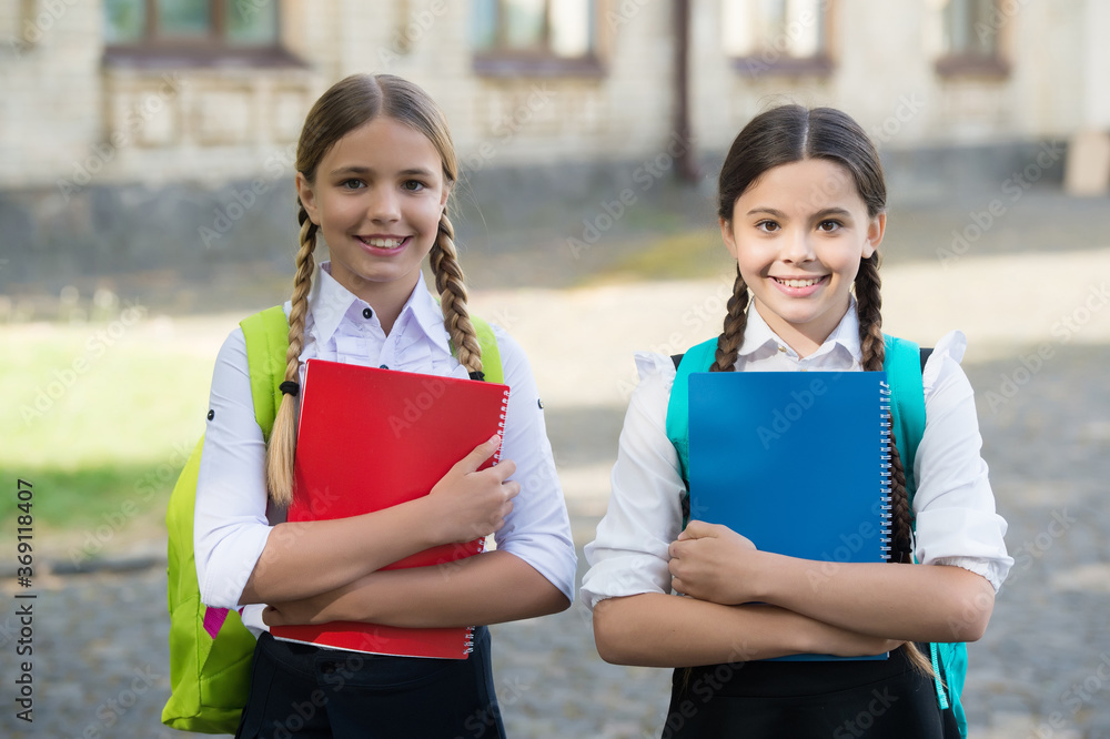 have fun while studying. Happy girls in school uniform. Smiling teen ...