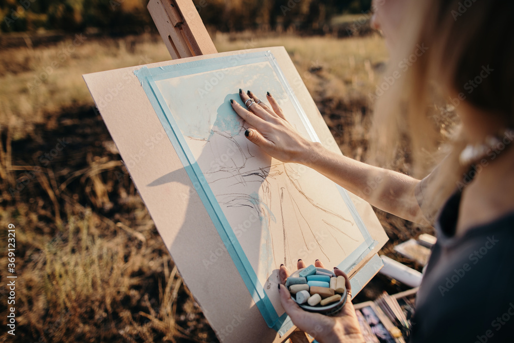 Crop woman drawing landscape in nature Stock Photo | Adobe Stock