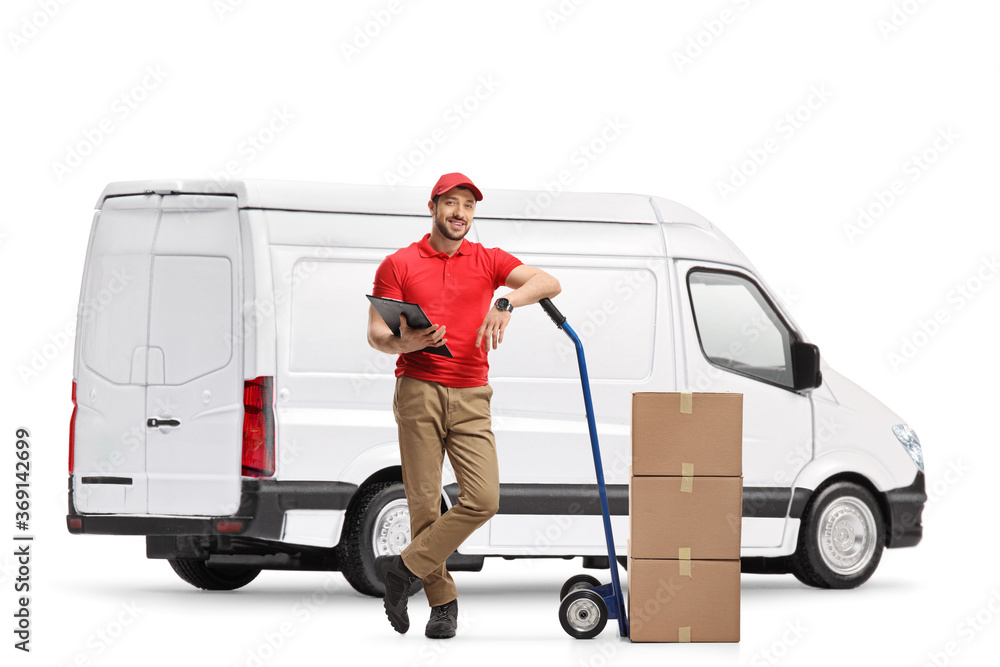 White delivery van and a male worker with boxes and a hand truck Stock ...