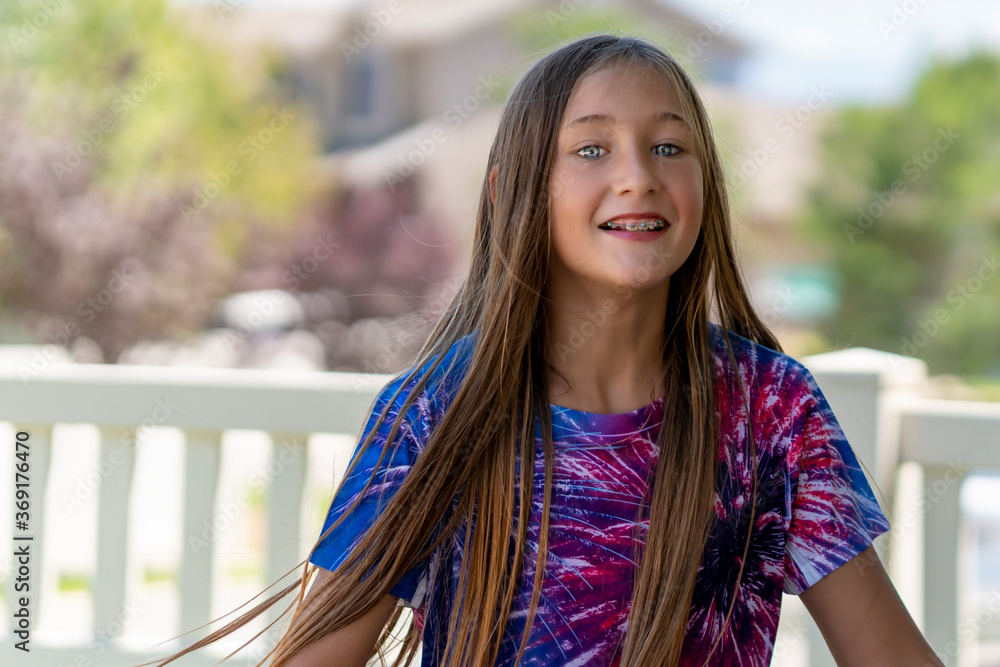 Cute, preteen girl smiles for a portrait Stock Photo | Adobe Stock