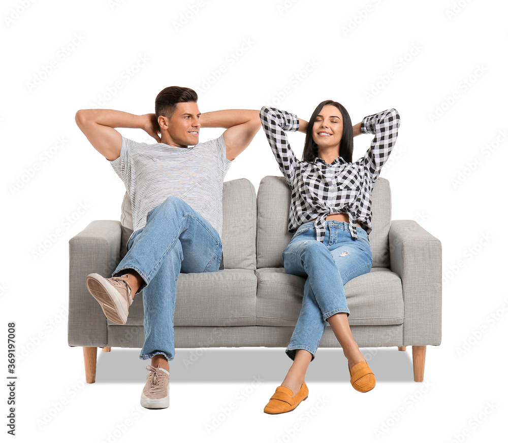 Young couple relaxing on sofa against white background Stock Photo ...
