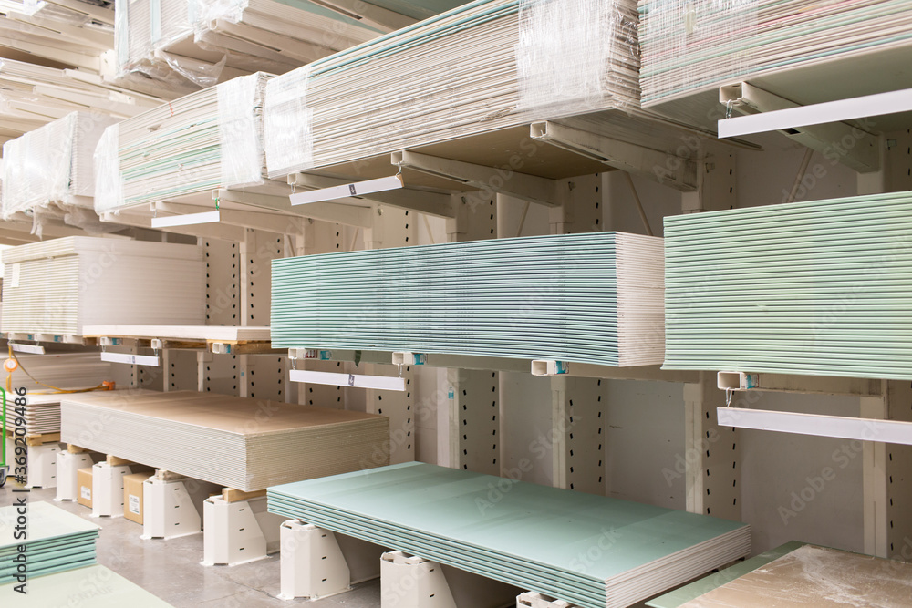 Pallet with Drywall sheets plasterboard in the building warehouse store ...