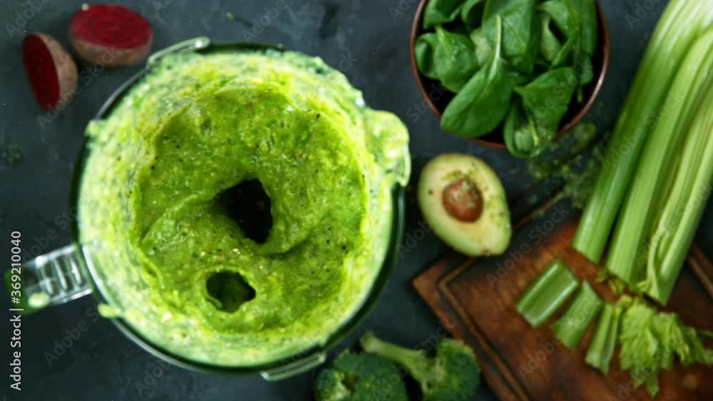 Green fresh smoothie blended in blender, top view. Healthy eating ...