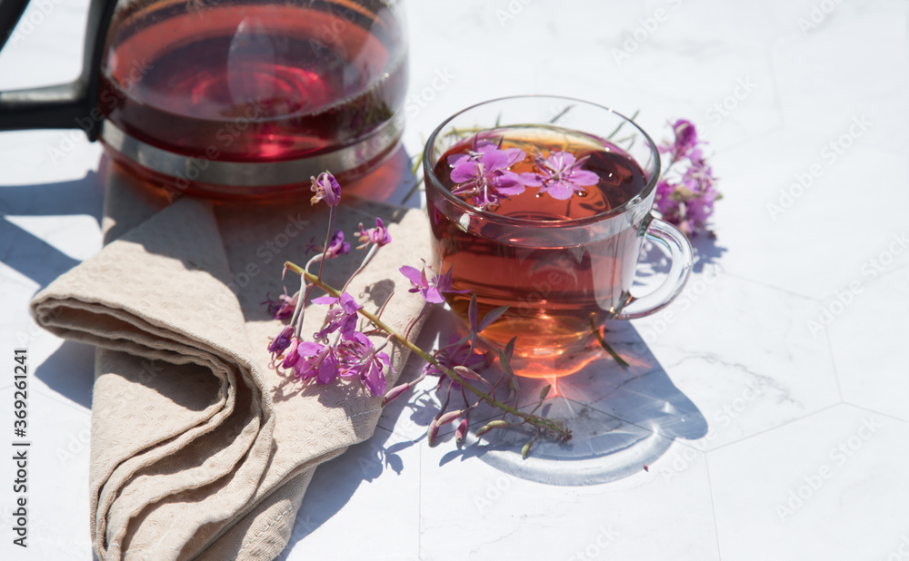 Herbal tea from fermented kipreya leaves in a glass Cup on a light ...