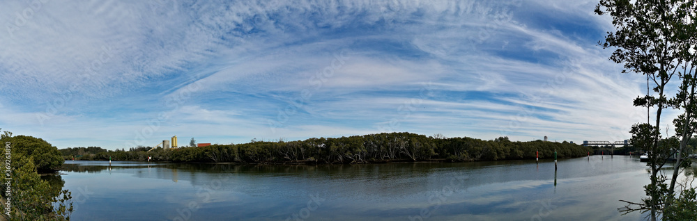 Beautiful panoramic view of a river with reflections trees, deep blue ...