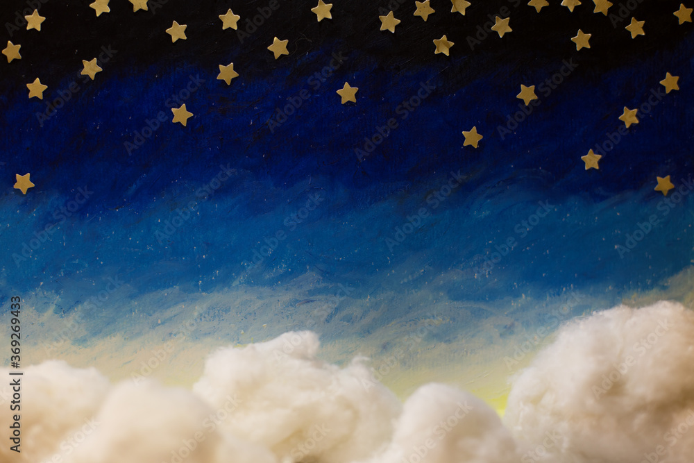 Cartoon painted night sky with bright paper stars and cotton handmade ...