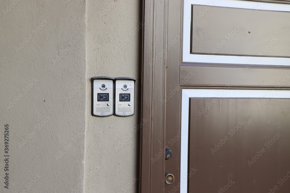 Wooden door. Outdoor Video Intercom Door Station on the wooden wall ...