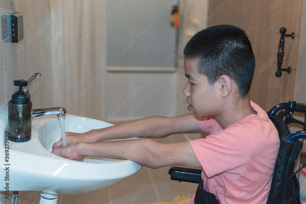 Happy asian disabled on wheelchair wash hands for hygiene and prevent ...
