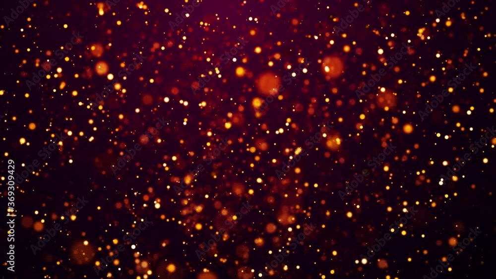 Golden red glow particles flicker and float in viscous liquid with ...