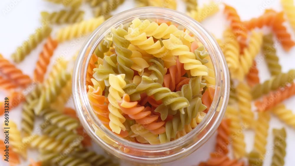 Variety of types and shapes of dry Italian pasta in a bowl. vídeo do ...